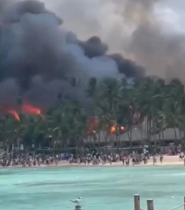 Woman dies after huge fire rips through luxury beach resort as 1,700 ...
