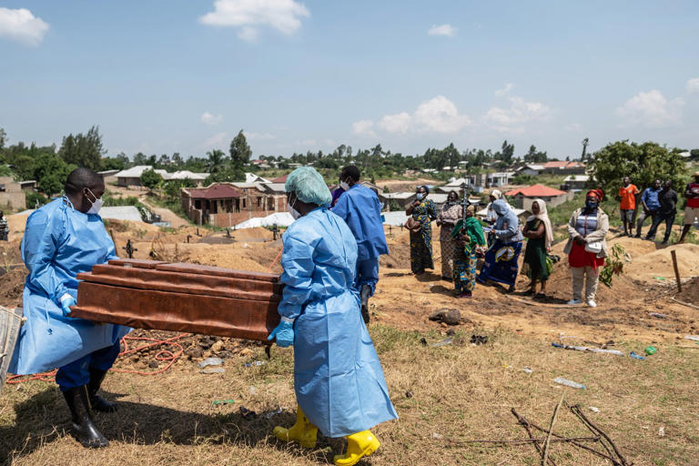 Mourners bury a 6-month-old Ebola victim in the Congo outbreak's third ...