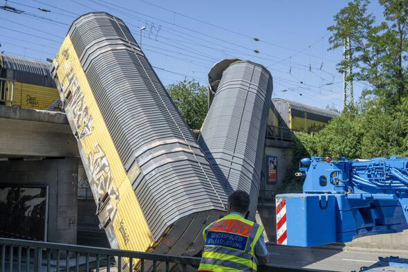 Munich train crash horror as carriages derail and plunge off bridge