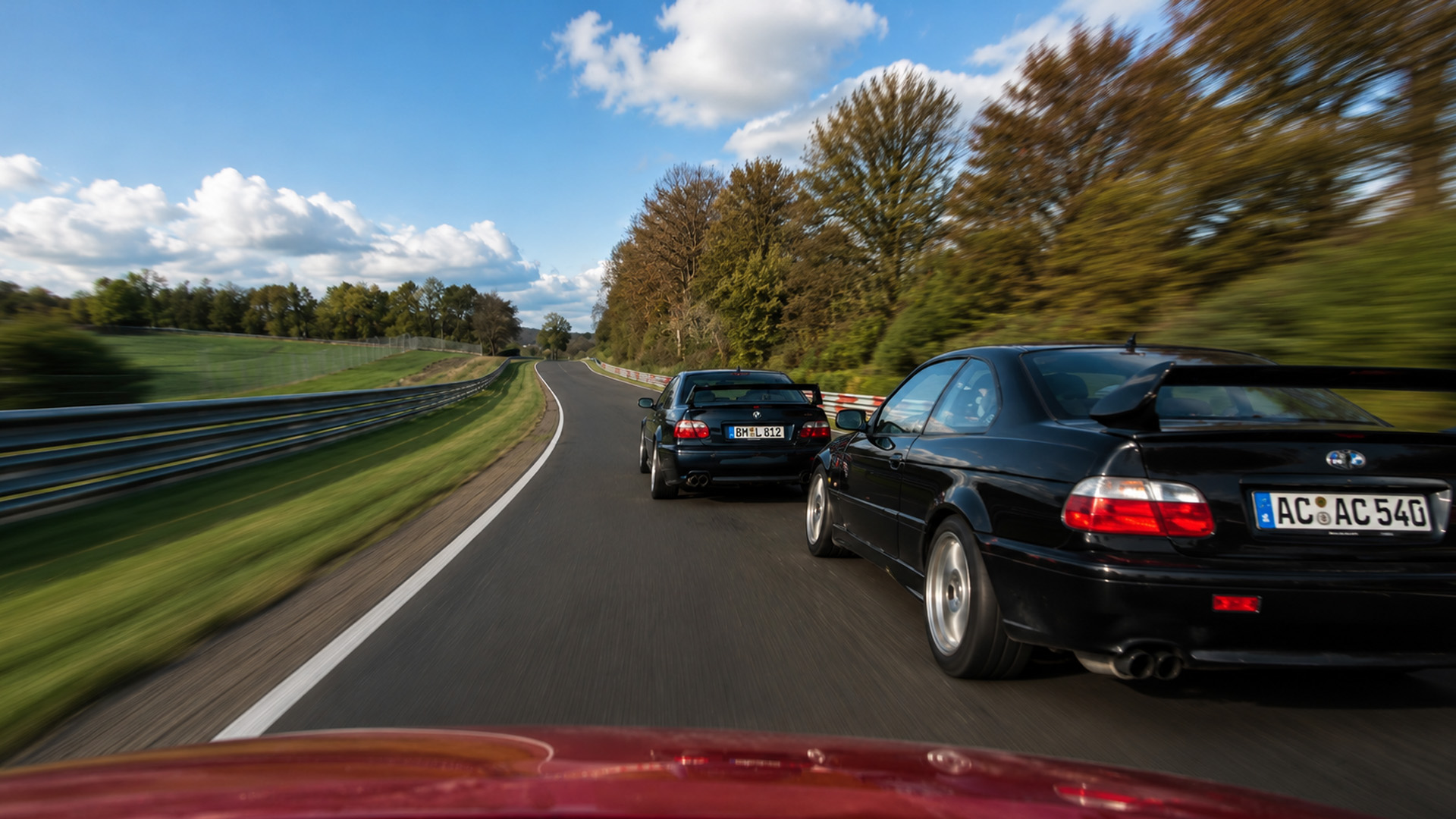 Inside VW Golf fights BMWs through a tight track corner