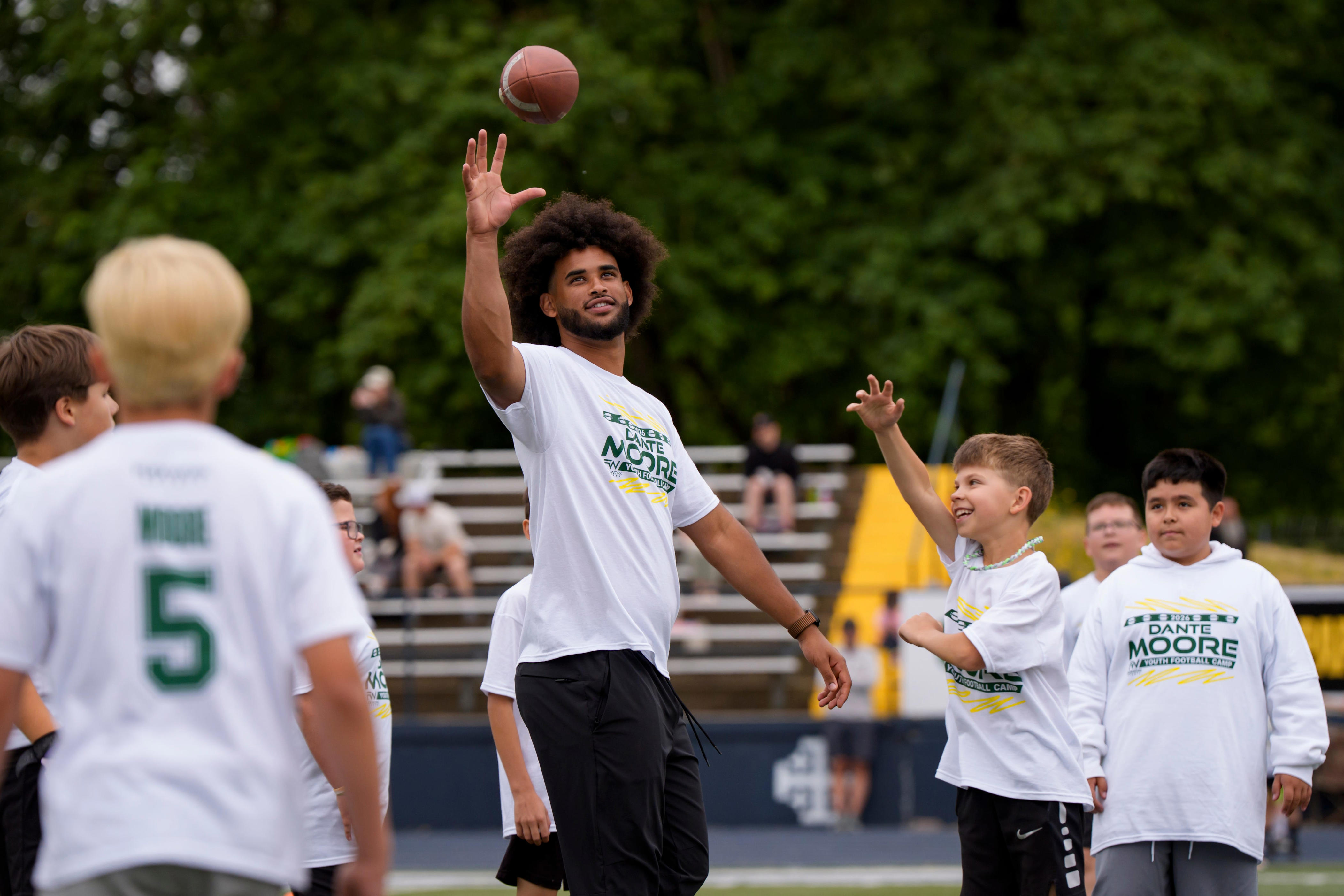 Oregon's Dante Moore hosts hundreds at Eugene youth football camp