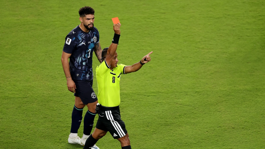 Paraguay edge Turkey to stay alive as new rule sparks first red card