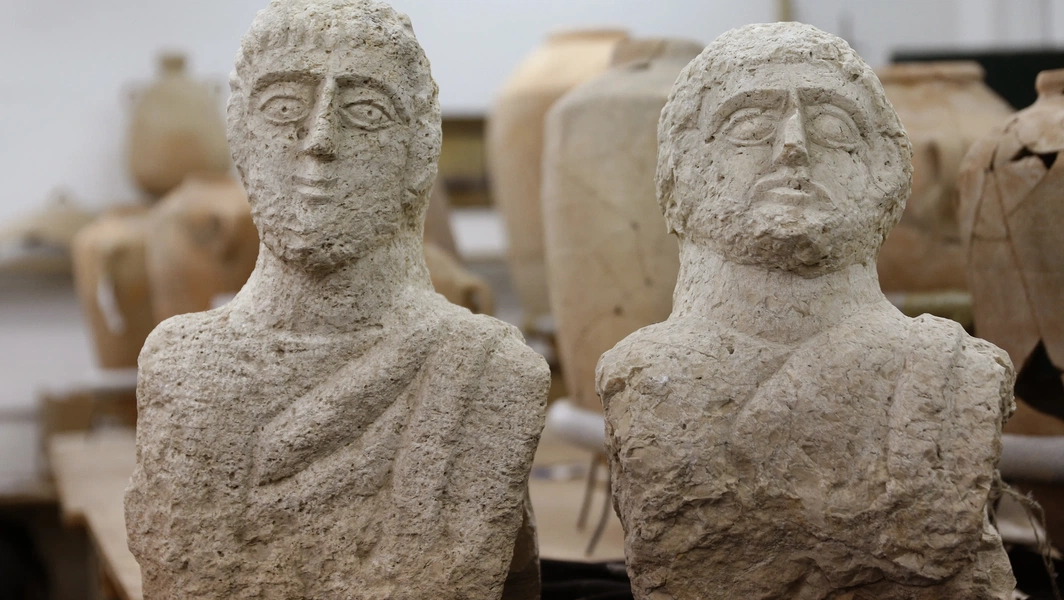Two intact Roman busts found buried in ancient winepress
