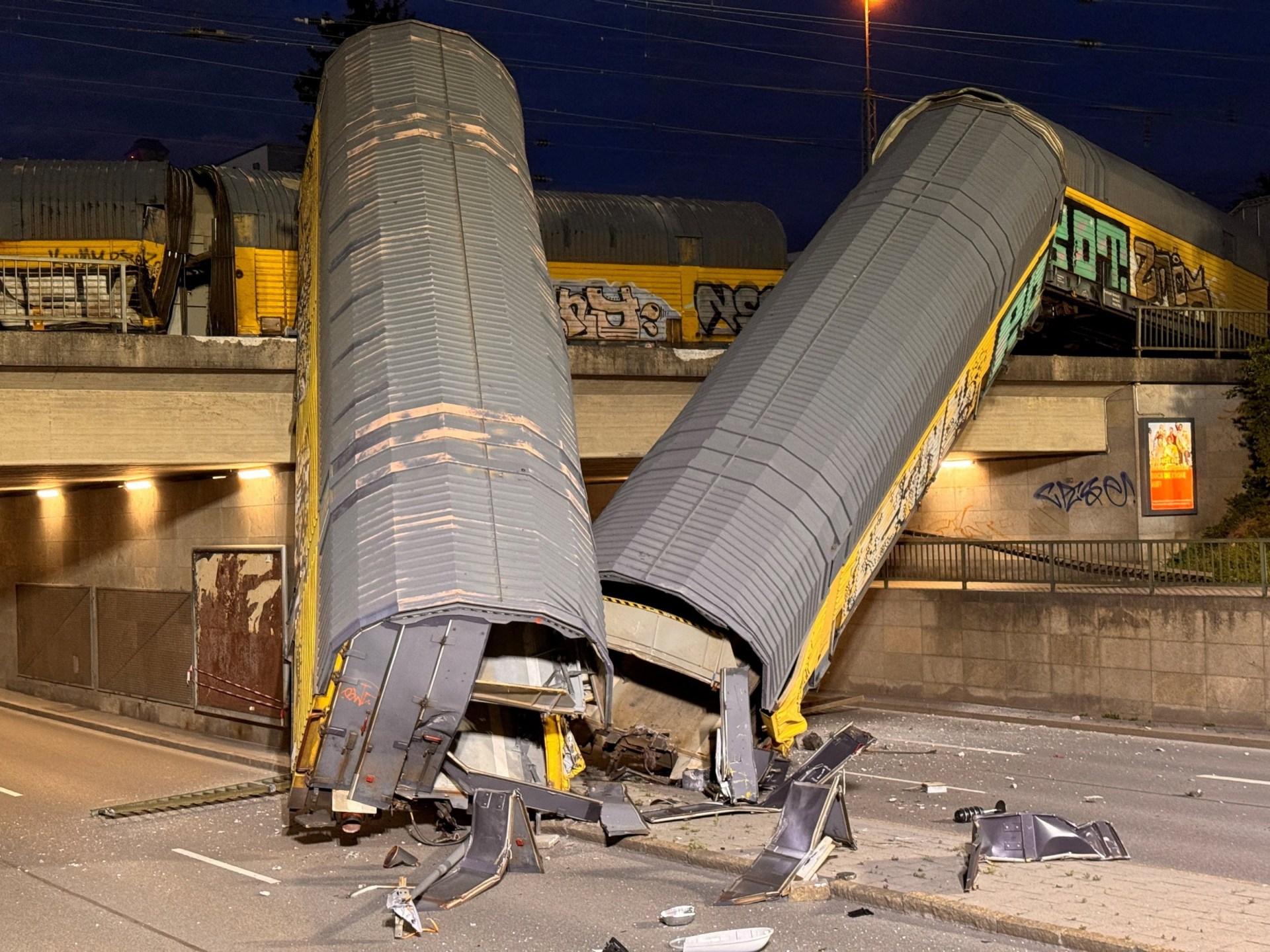 One dead after freight train derails and falls off bridge in Munich ...