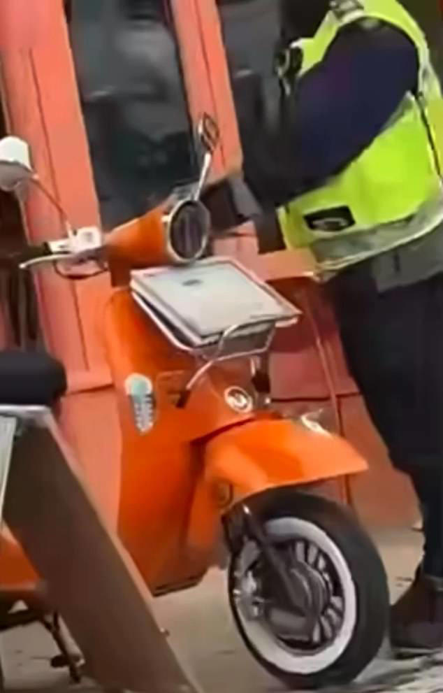 Traffic warden issues parking ticket to Vespa mascot on display outside ...