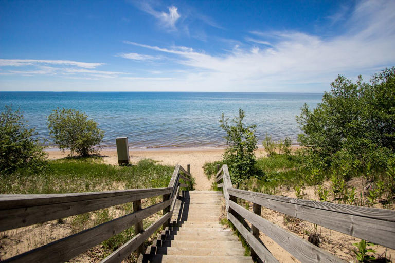 This tiny Michigan town has a historic lighthouse, cozy inns, and the ...