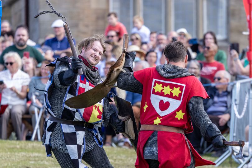 Bamburgh Castle hosts live jousting as knights battle in front of sell ...