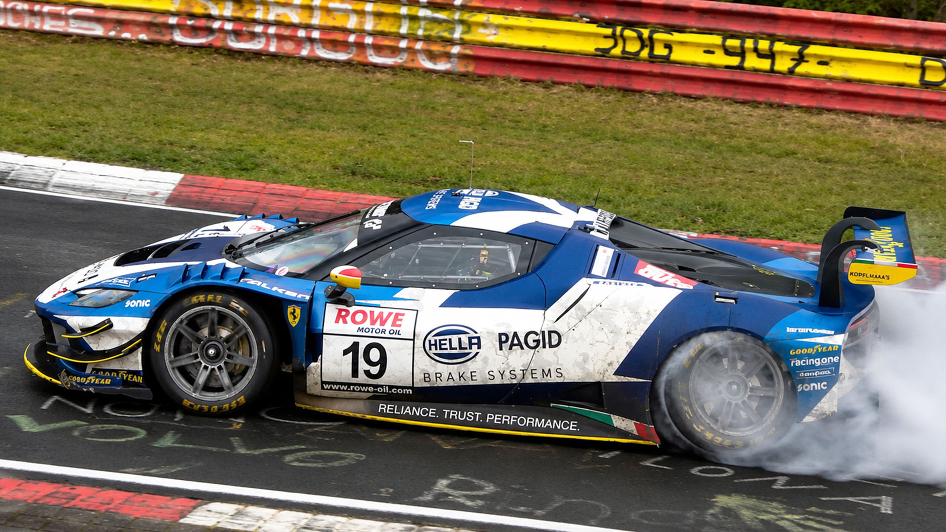 Driver fights recovery after sudden spin during race action