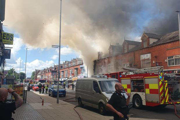 Two in hospital after blaze tore through busy takeaway leaving building ...