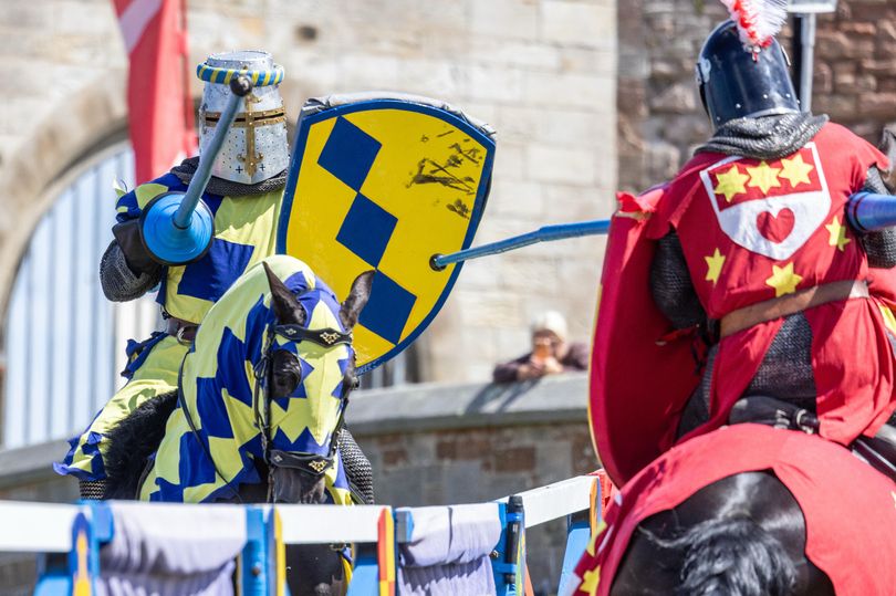 Bamburgh Castle hosts live jousting as knights battle in front of sell ...