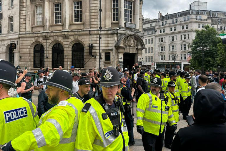 Four held as police fight to keep order amid tense Britain First rally ...