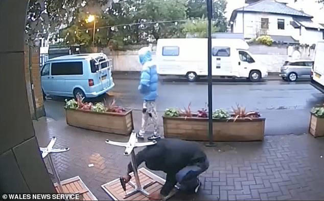 Table for two: Moment thieves are caught on CCTV taking drills to pub ...