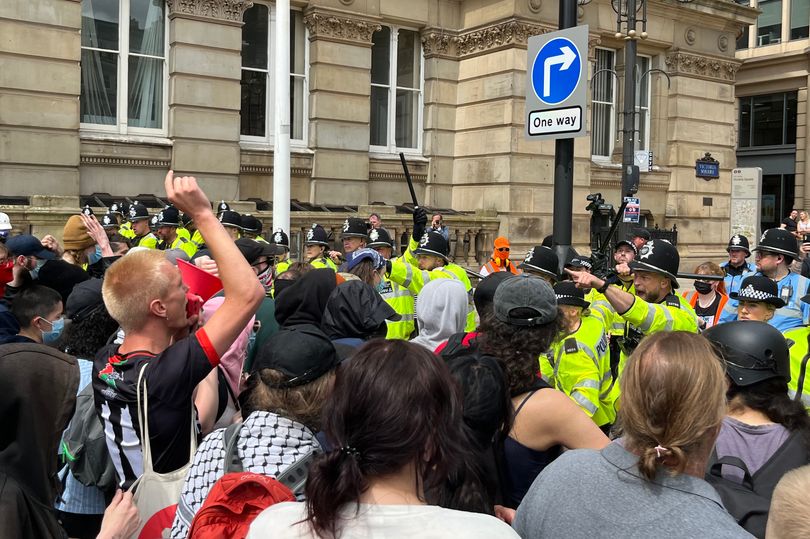 Four held as police fight to keep order amid tense Britain First rally ...