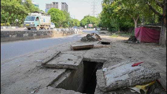 Gurugram: GMDA desilting leaves open drains on Sec 45 footpaths