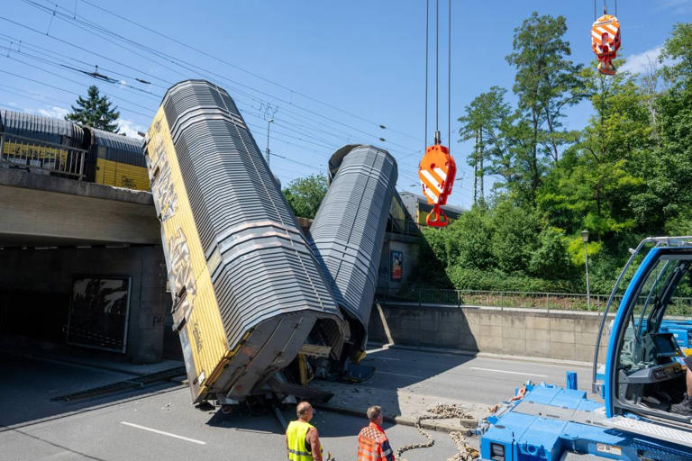Freight train crash in Germany leaves 1 dead, two wagons dangling off ...