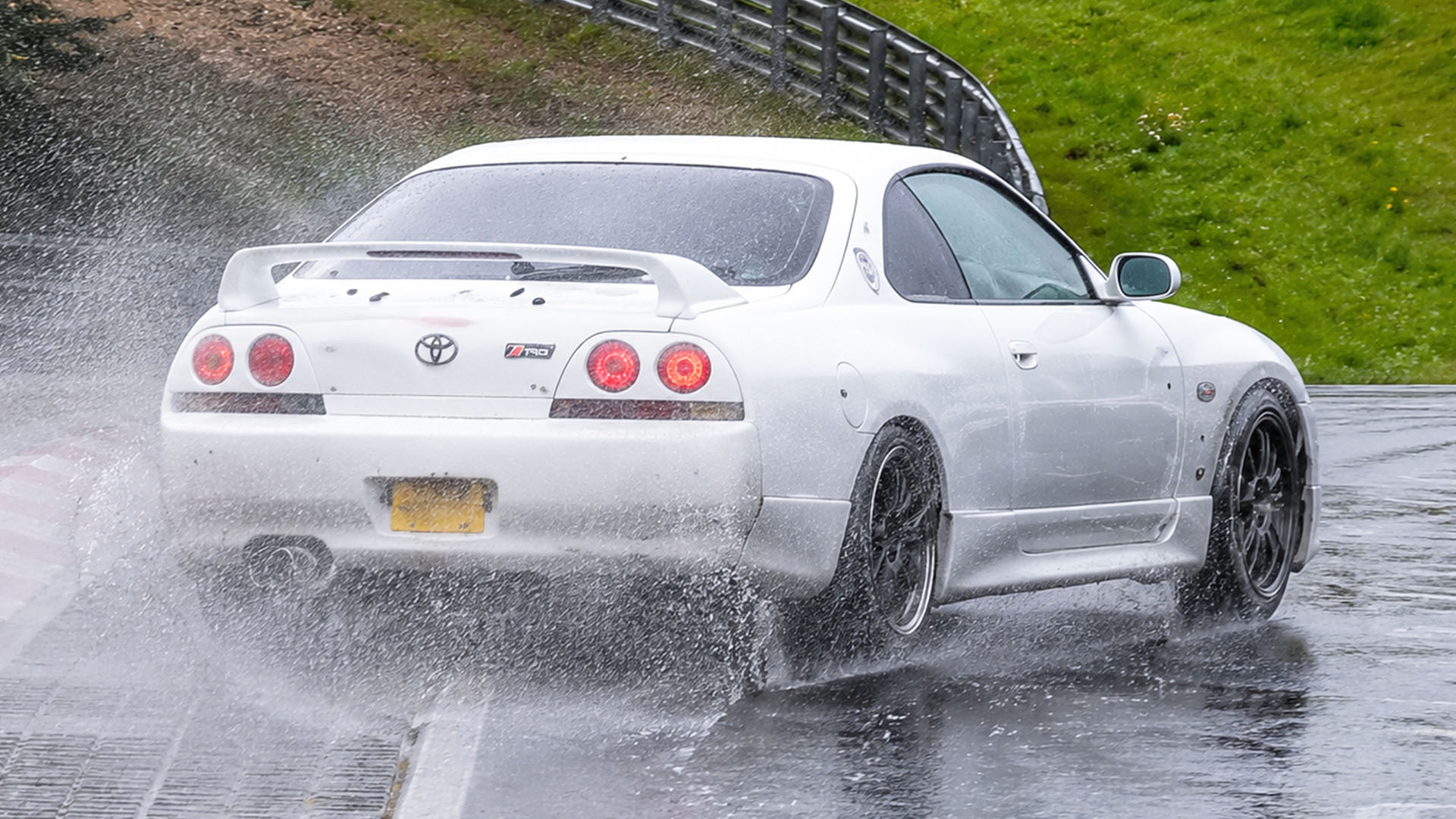 Massive water spray hides the true speed of this GT-R