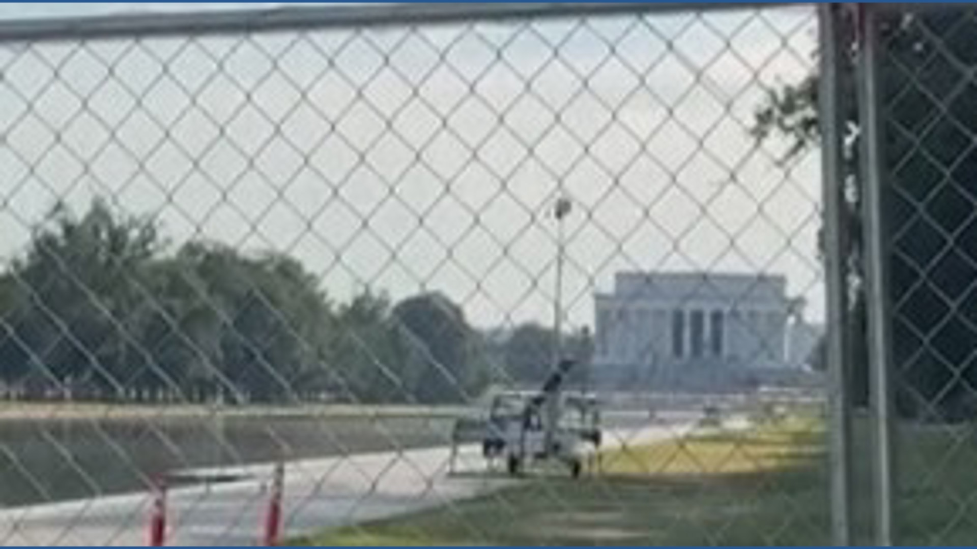 Fences surround the reflecting pool in DC