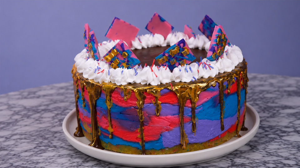 Gold drip creates a dramatic cake design