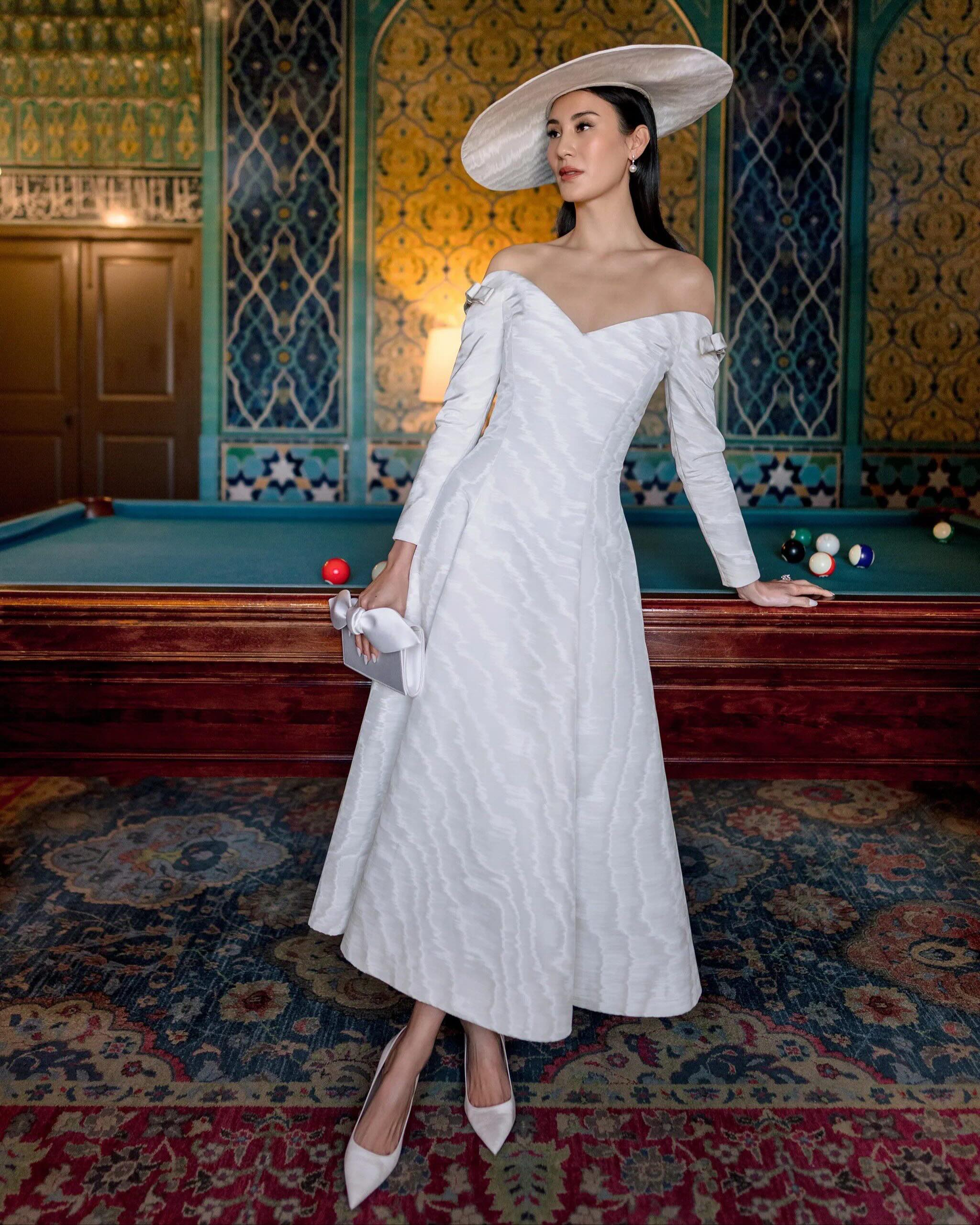 Chinese bride Ann Liu stuns in 13 couture gowns across multi-continent ...