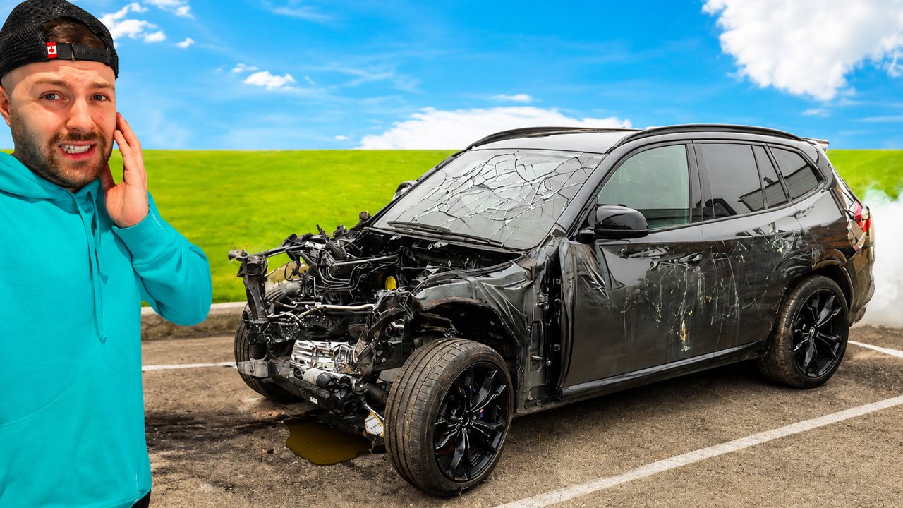 Installing the engine while rebuilding a smashed BMW X3M from scratch