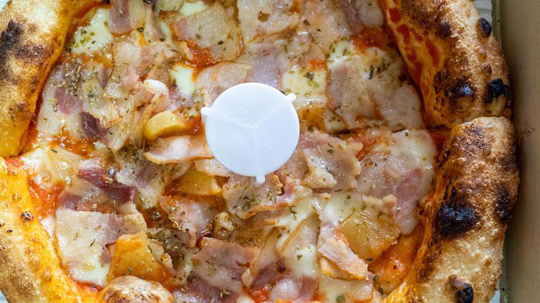 Why do pizza boxes have those tiny plastic tables?