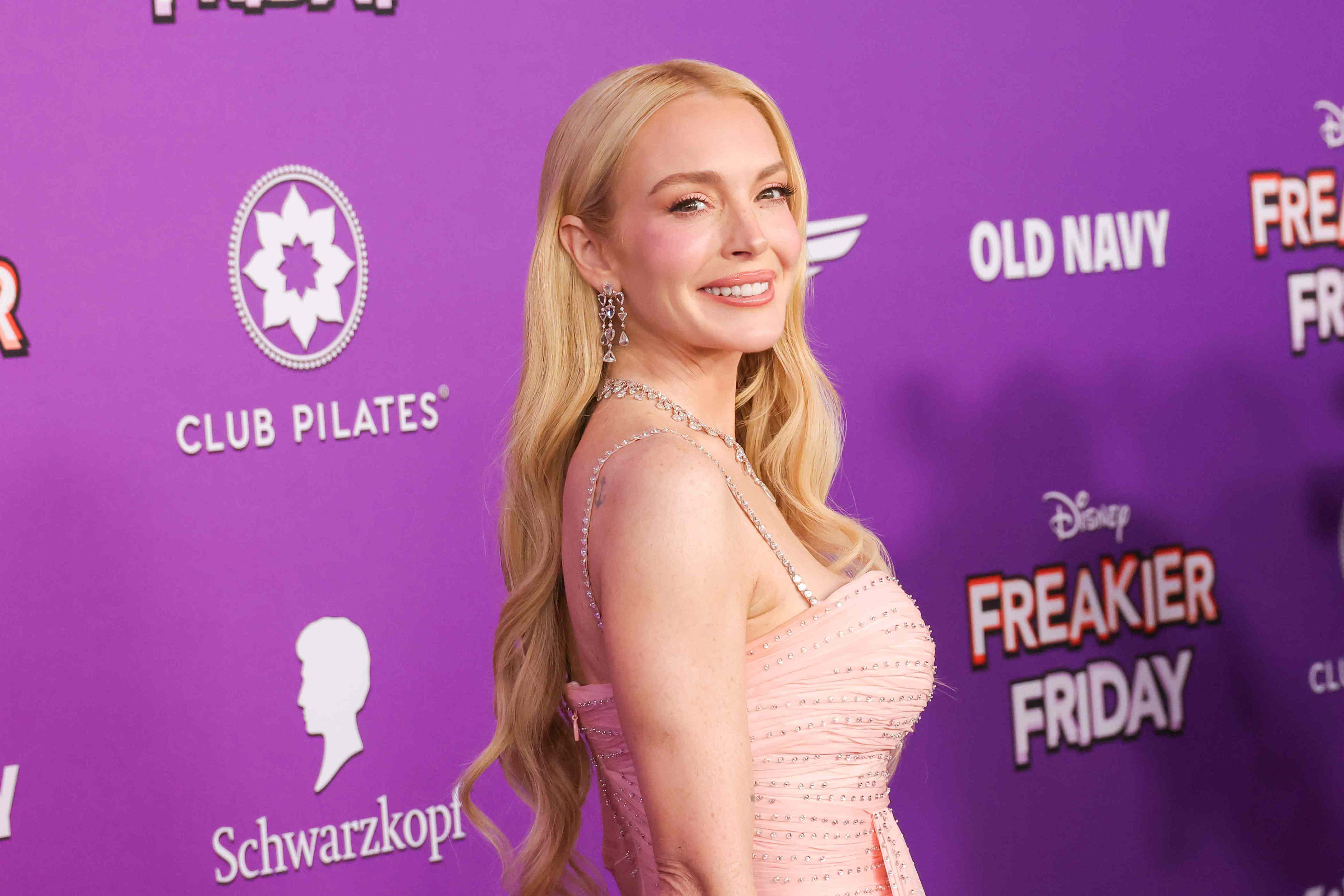 Lindsay Lohan dazzles in a vintage Chanel micro-suit with a cropped ...