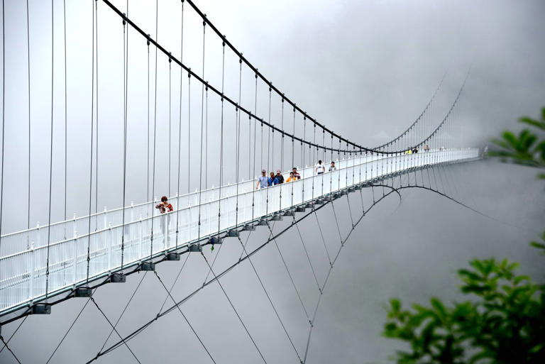 China teenager cracks panel on tourist site’s glass bridge; public ...