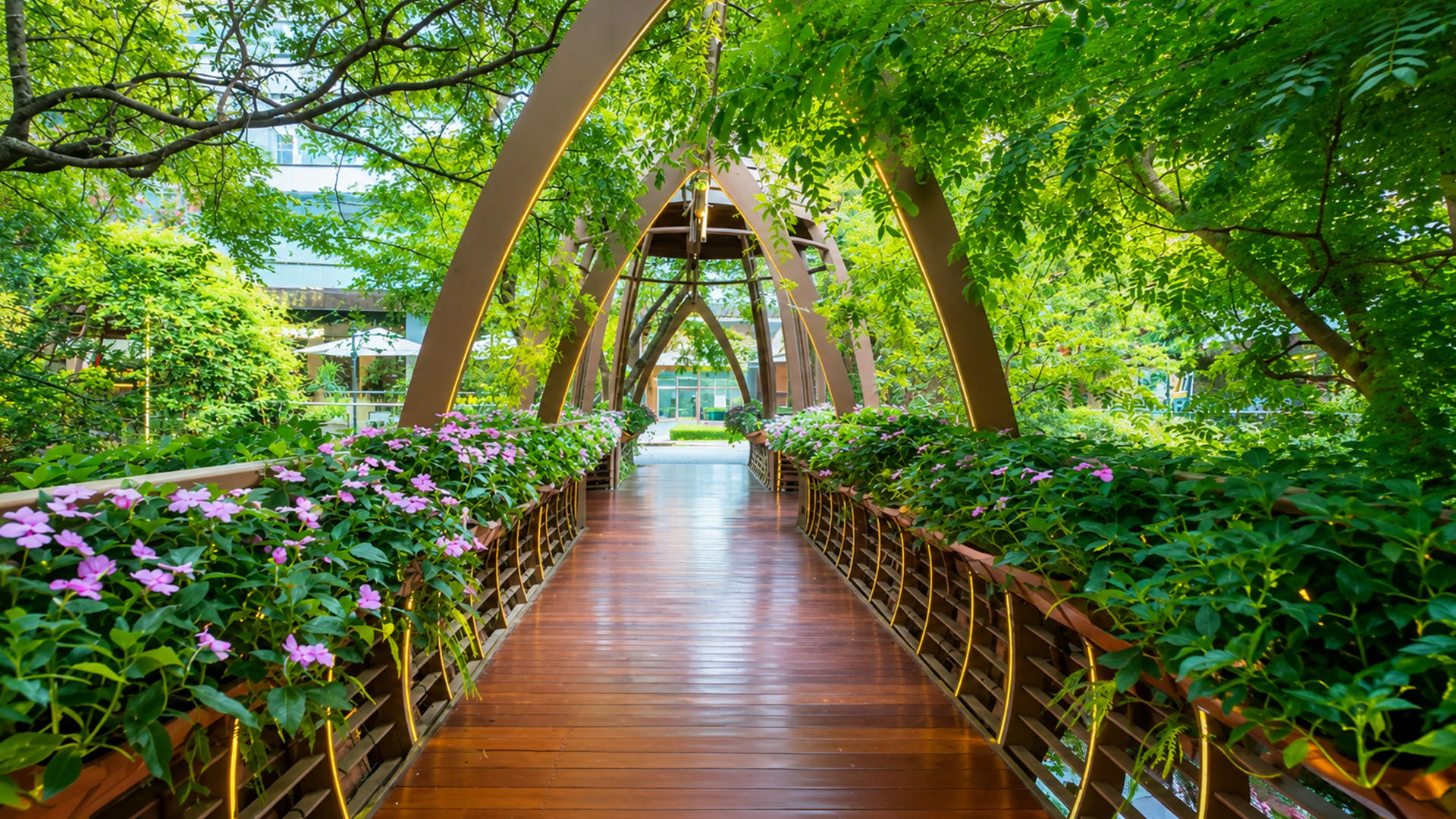 A wooden garden bridge turns this mall into a green urban escape