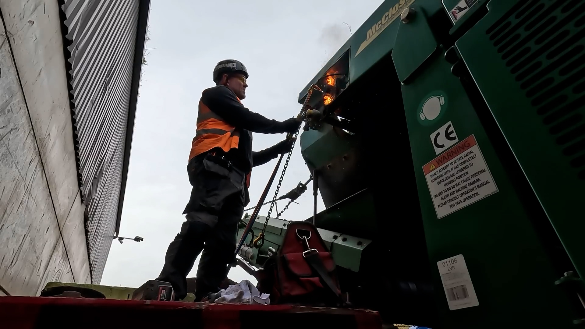 On-site industrial welding repair on heavy machinery in action