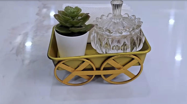 Use an old plastic food container for cute countertop storage instead ...