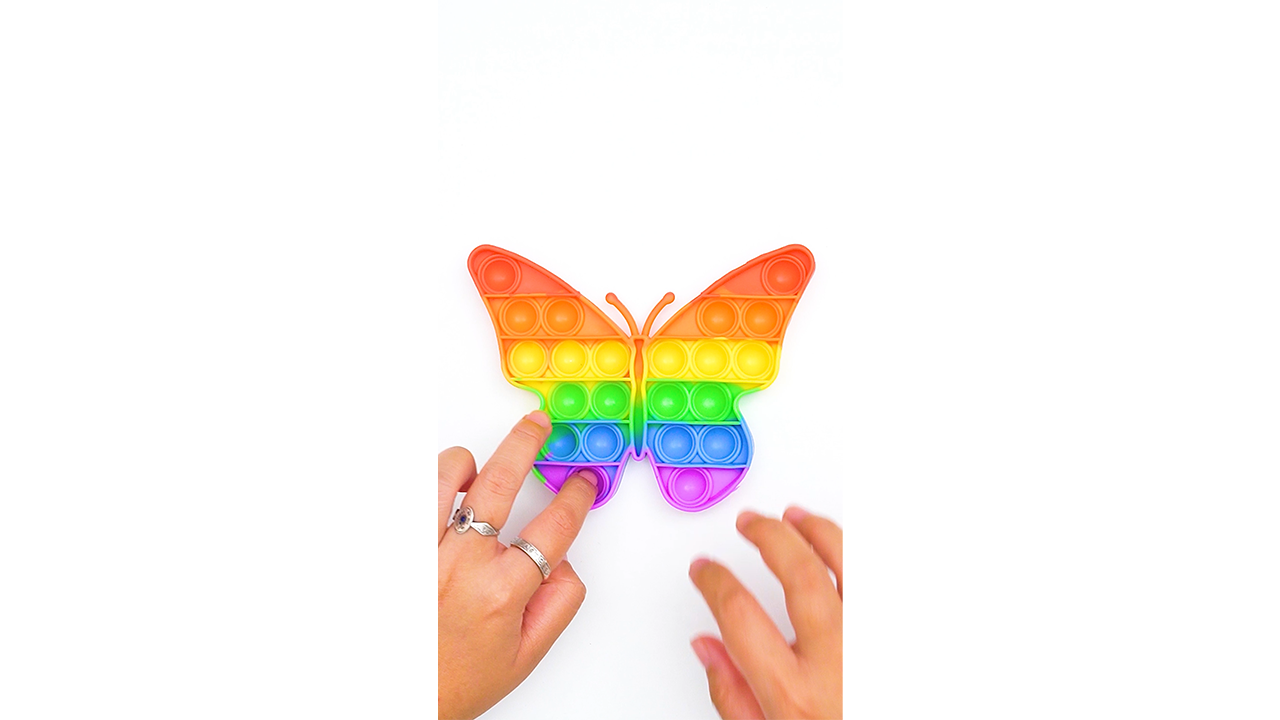 Pressing a rainbow butterfly pop it with smooth bubble texture