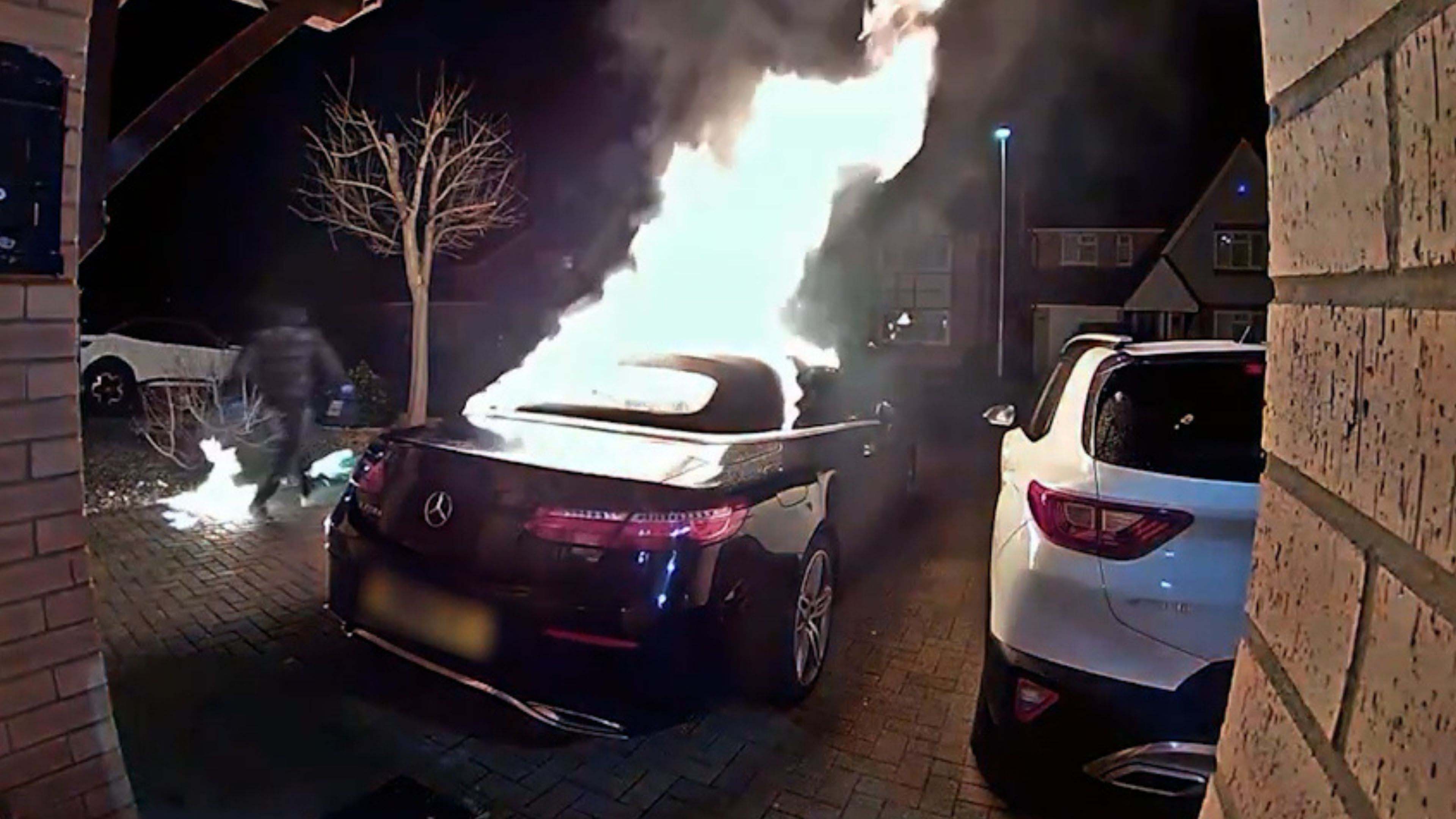 Arsonist caught on CCTV torching $59k Mercedes on driveway
