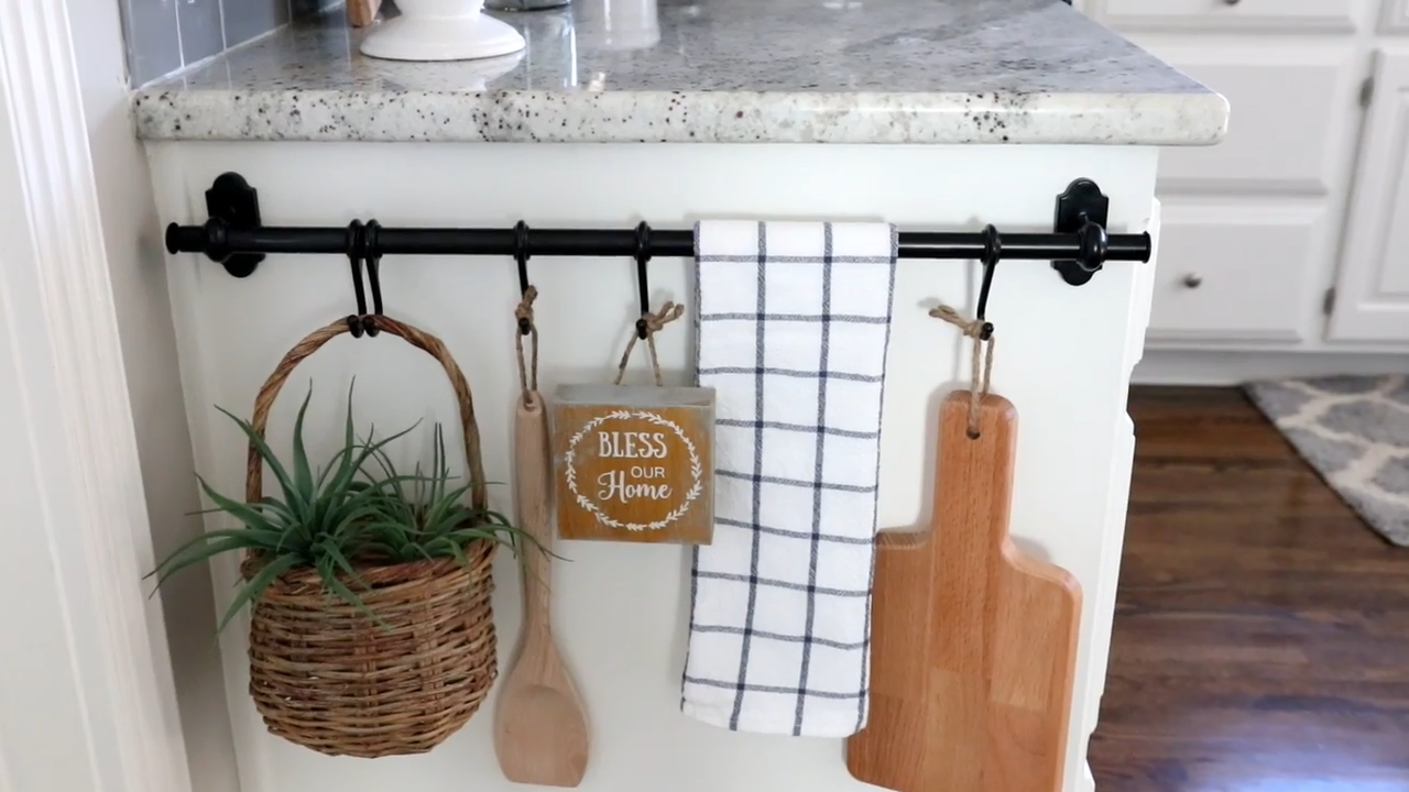 A simple board becomes a farmhouse kitchen towel rack