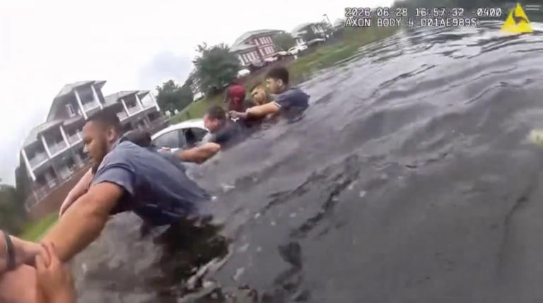 Virginia first responders form human chain to rescue driver from ...