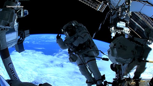NASA astronauts fix robotic arm during spacewalk