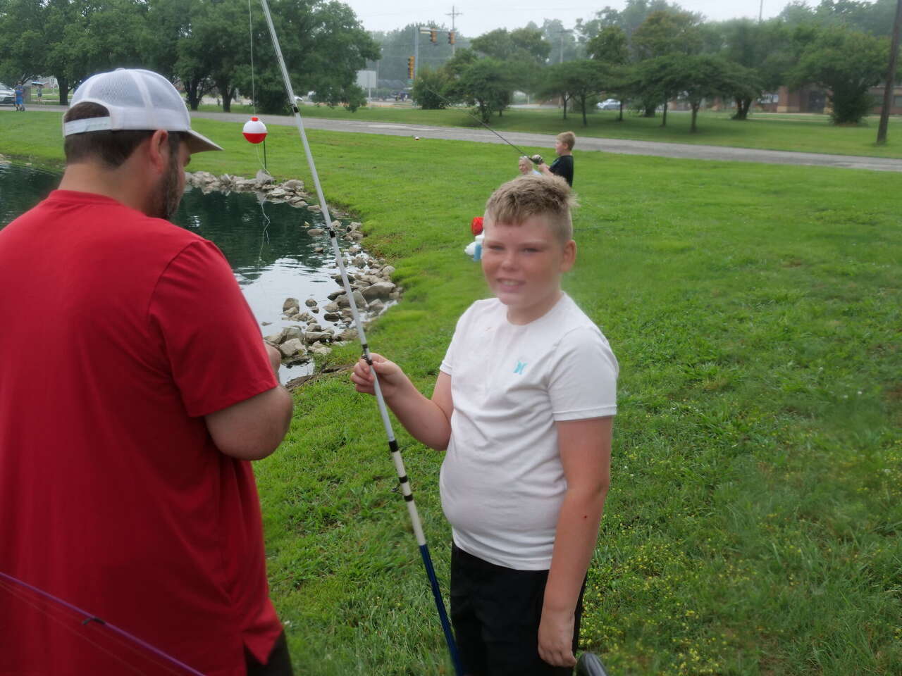 Kids cast lines and reel in prizes at Godfrey fishing derby