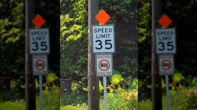 Why do some speed limit signs have an orange diamond on top?