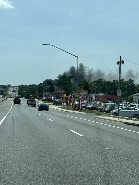 Thick black smoke billowed from Rosedale tire shop fire
