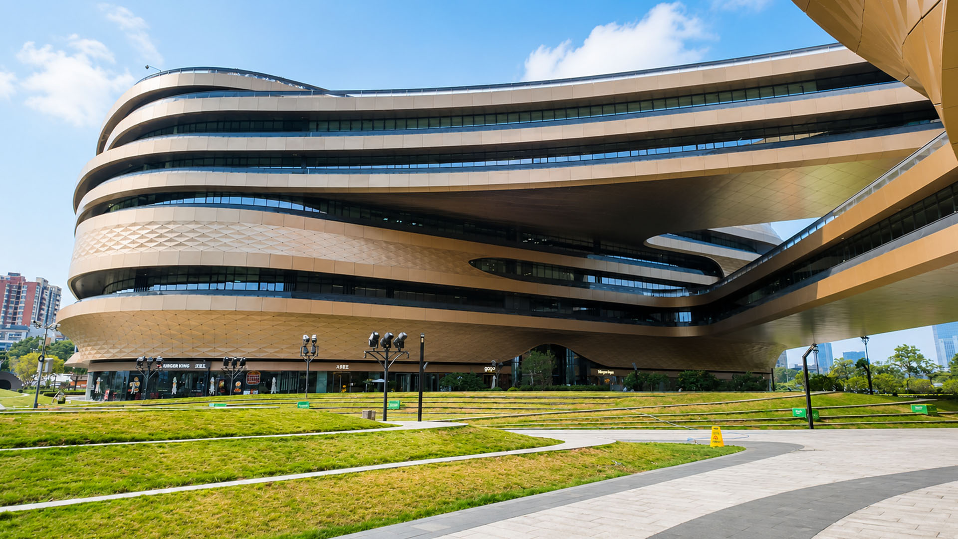A massive shopping complex blends soft lines with urban grandeur