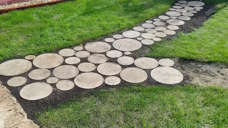 Use old plastic nursery pots to create budget-friendly pavers with a ...