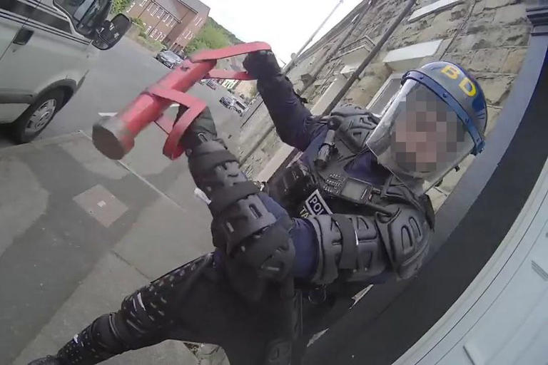 Moment police batter down Great Harwood house door in cannabis farm raid