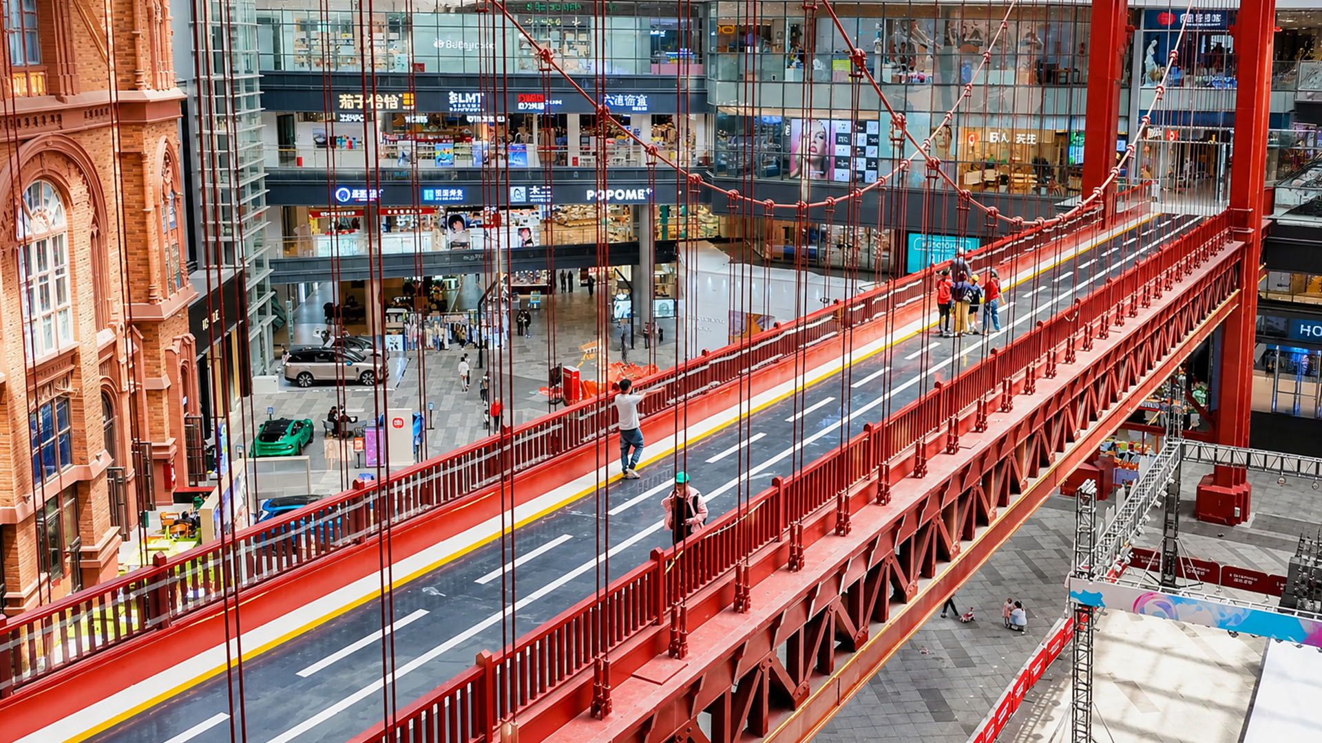 A red suspension bridge turns this mall atrium into a landmark