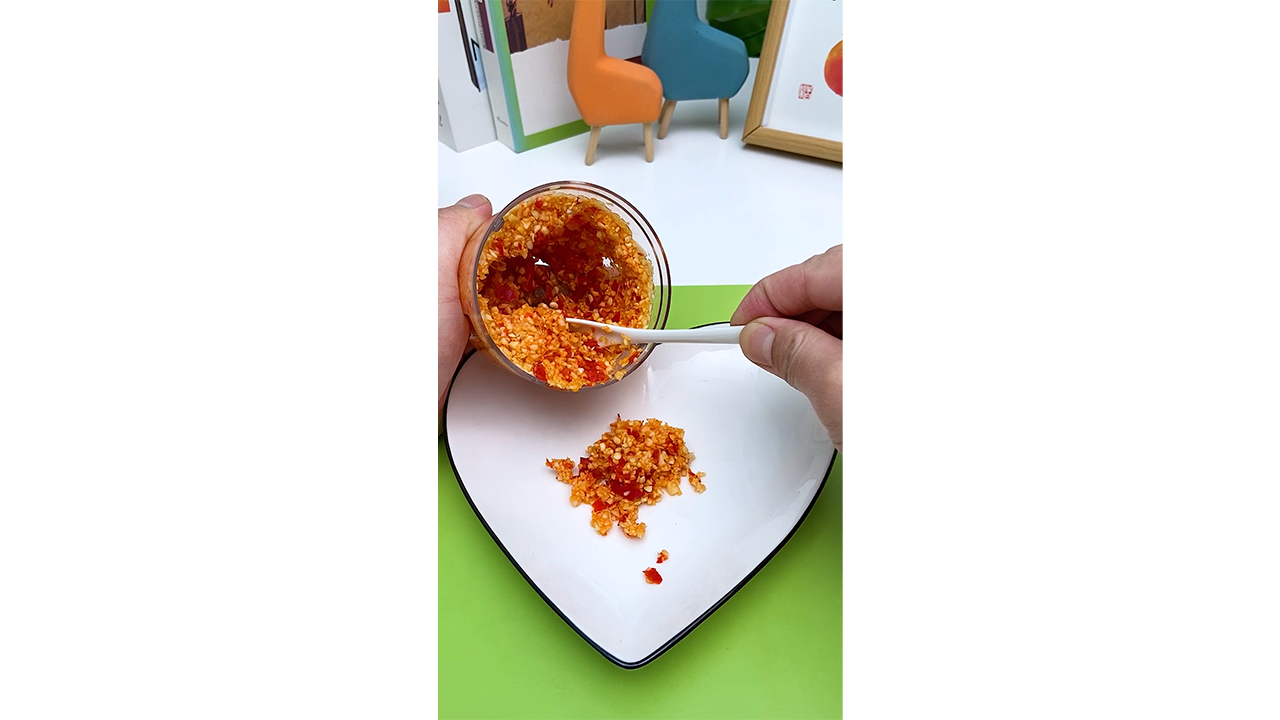 Grinding fresh garlic and chili with mini food chopper resulting in ...