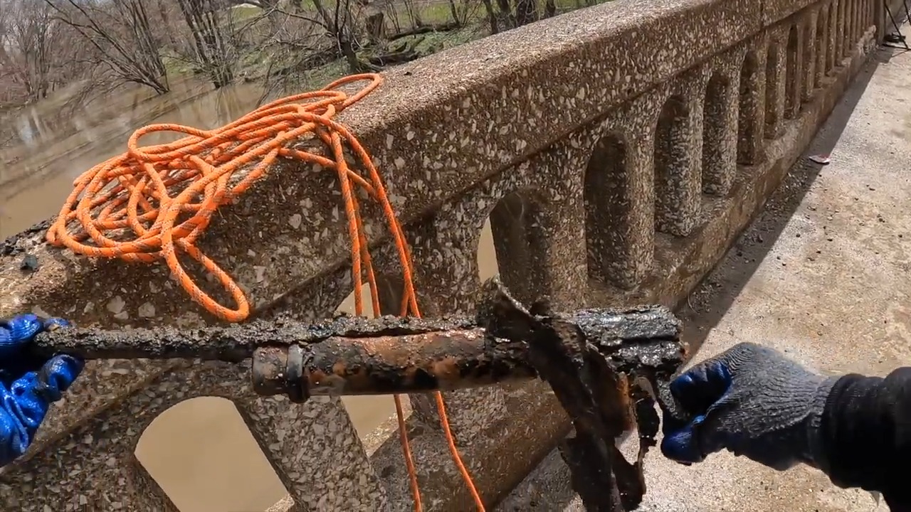 They found a magazine first - then a shotgun came out of the river ...