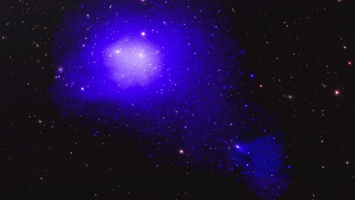 Galaxy cluster leaving trail of hot gas in its wake after eating its ...