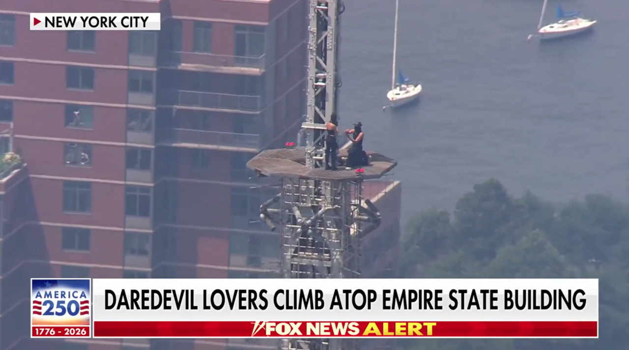 Daredevil couple arrested after scaling Empire State Building spire for ...
