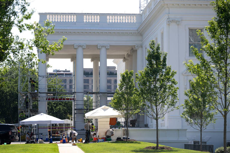 Scaffolding goes up around the White House’s North Portico