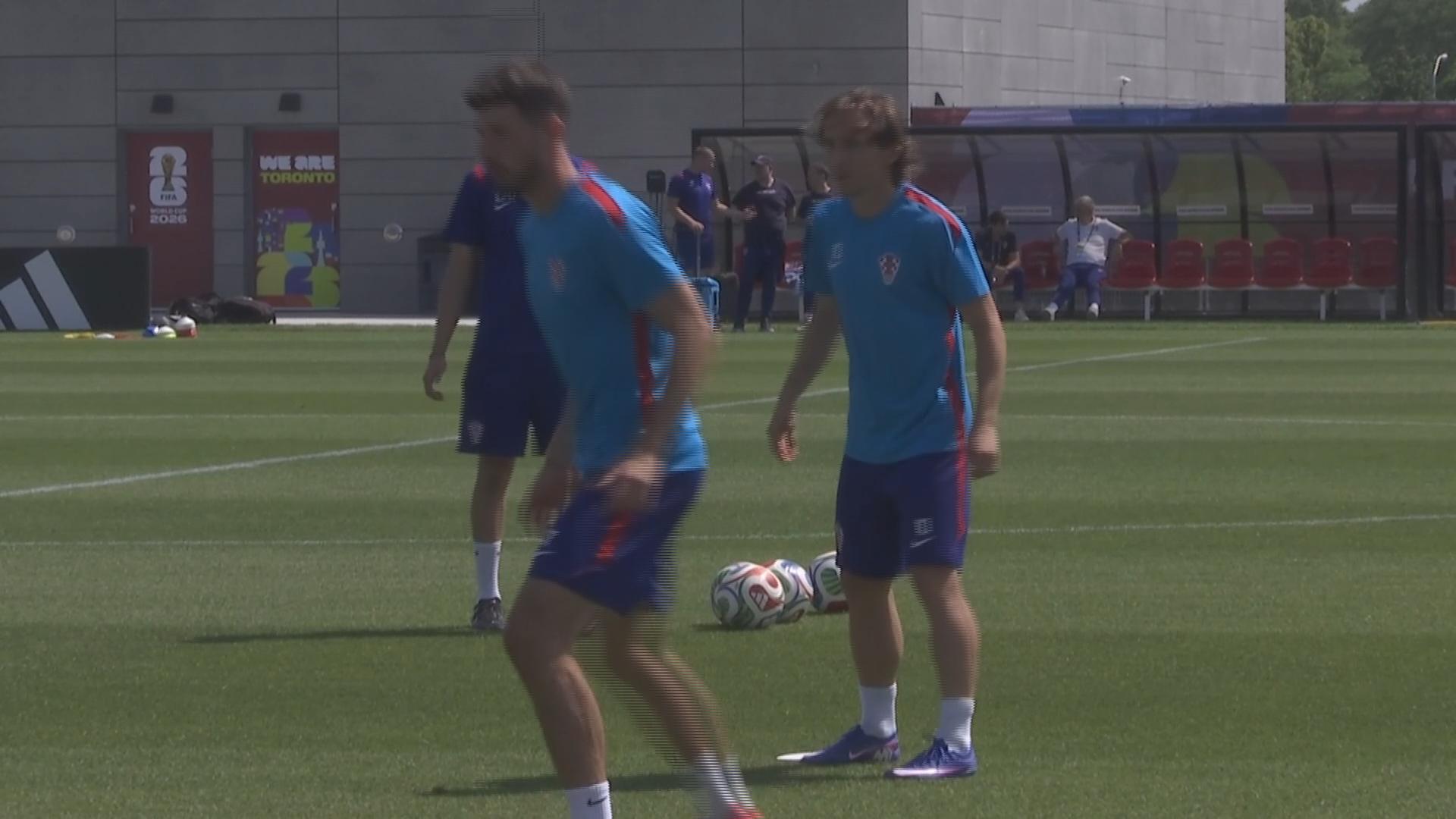 Modric gets cooled down by sprinkler as Croatia prepare for Portugal in ...