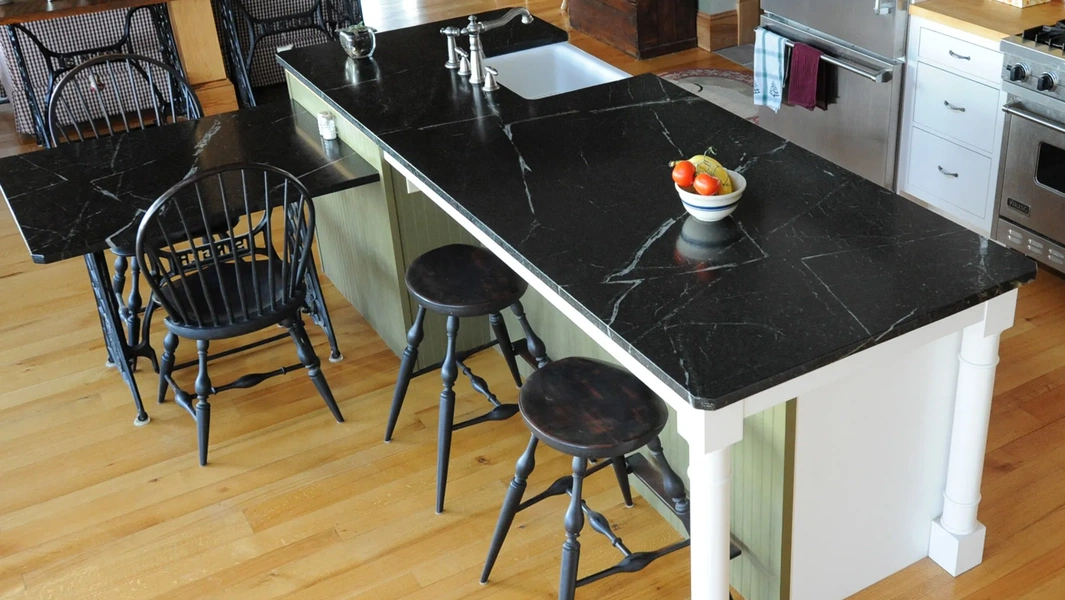 Oversized kitchen islands give way to flexible, communal designs
