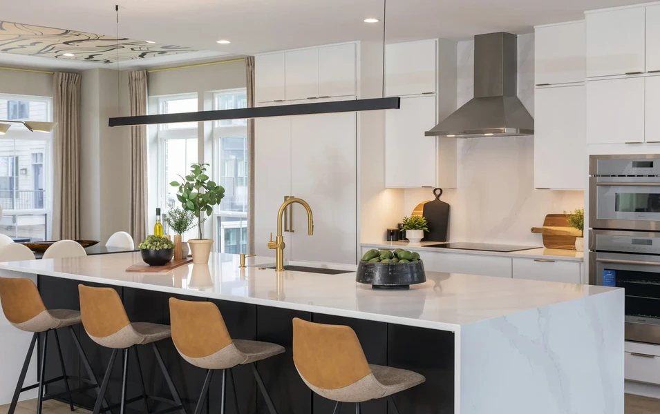 Oversized kitchen islands give way to flexible, communal designs
